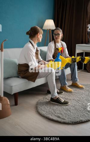 Young janitors cleaning in modern office Stock Photo - Alamy