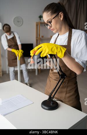 Close-up Of A Janitor Cleaning Desk With Cloth Stock Photo - Alamy