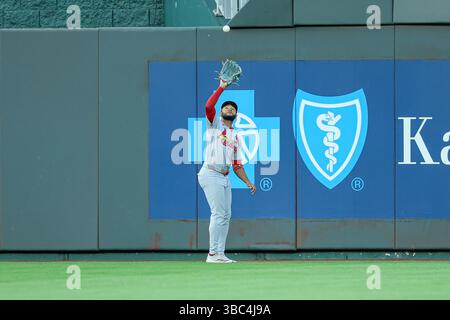 St. Louis Cardinals' Victor Scott II, left, scores next to San ...