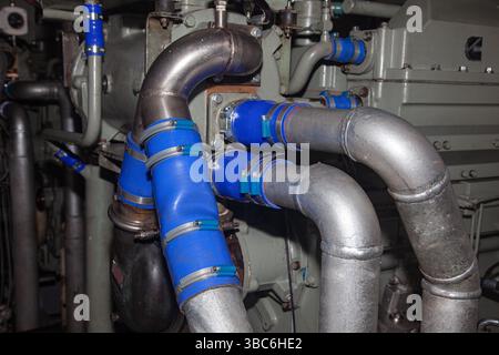 Connecting steel pipes on a marine diesel generator Stock Photo - Alamy