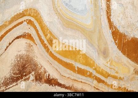Flat, orange, yellow and gray slate stone with abstract wave pattern ...