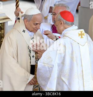 Pope Leo XIV receives the pallium, or lambswool stole, a symbol of the ...