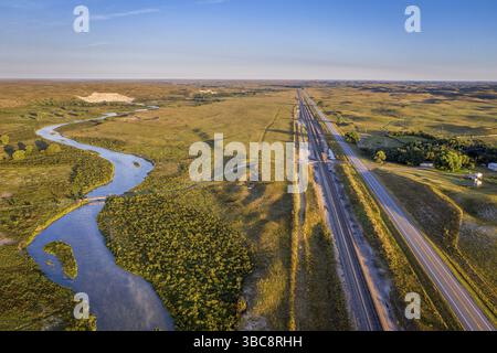 highway and railroad along the Middle Loup River in Nebraska Sandhills ...