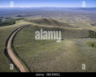 windy back country road aerial view - Independence Mountain Road in ...