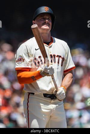 San Francisco Giants' Matt Chapman, right, reacts after hitting a solo home run during the ...