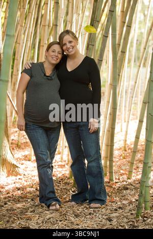 Pregnant sisters Hadley and Sarah outdoors Stock Photo - Alamy