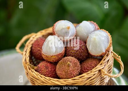 Fresh lychee in a bamboo basket Stock Photo - Alamy