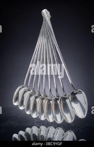 Collection of fanned out silver spoons Stock Photo - Alamy