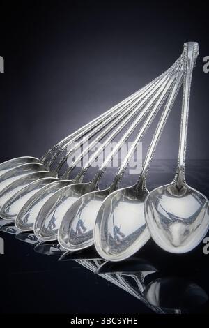 Collection of fanned out silver spoons Stock Photo - Alamy