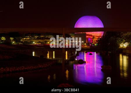 The World Showcase lake, and Spaceshipe earth dome at night, Epcot amusement park, Disney World ...