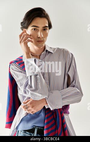 A stylish non binary individual poses confidently, embracing vibrant ...
