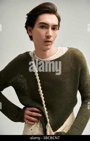 Non binary individual showcases unique fashion in a minimalist studio ...