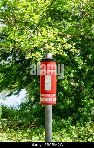 Red emergency life saving throwing line container Stock Photo - Alamy