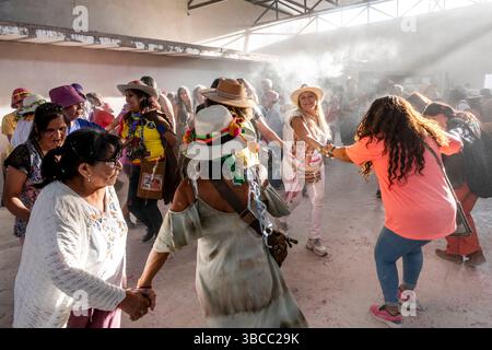 People Take Part In Carnival Celebrations Inside A Hall During The ...