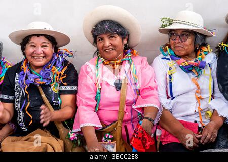 A Group Of Female Revellers Sitting Down Inside A Community Venue ...