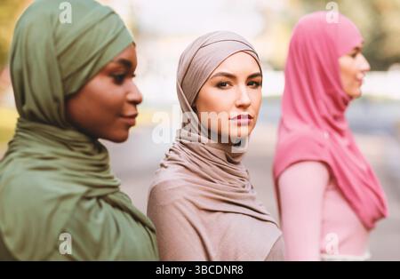 Group portrait of beautiful Muslim women in a fashionable dress with ...