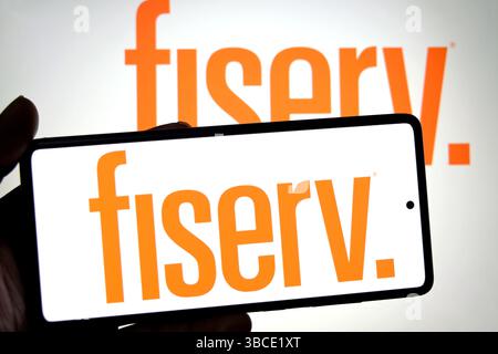 India. 18th May, 2025. In this photo illustration, a Fiserv logo is ...