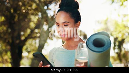 woman with exercise mat and smartphone at park Stock Photo - Alamy