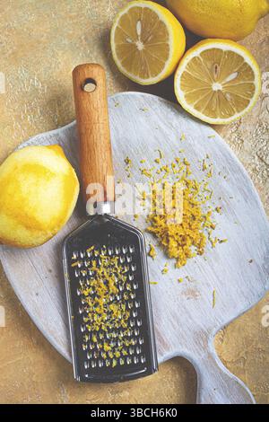 Grated lemon zest, grated, lemons, top view, on a cutting board, top ...