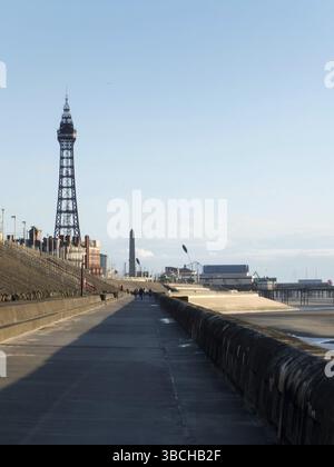View of blackpool tower and south pier from the promenade with town ...