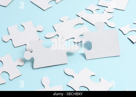 Building An Unfinished White Jigsaw Pattern Puzzle With Missing Last ...
