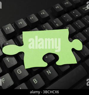 Sticker lying on black keyboard. Important message written over paper ...