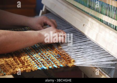 Part of loom, white thread, homemade, horizontal Stock Photo - Alamy