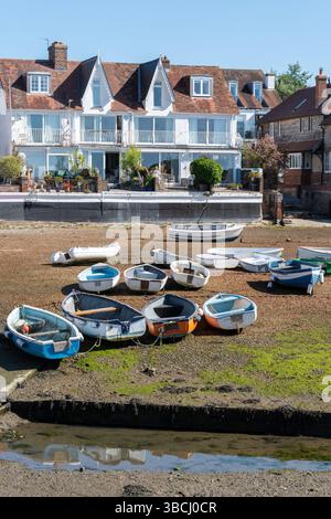 View of Emsworth Harbour with boats on the sand, a pretty town on the ...