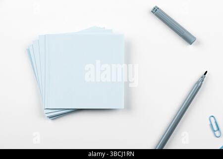 Notebook and Colored Papers Stickers Lying On White Desk. Multiple ...