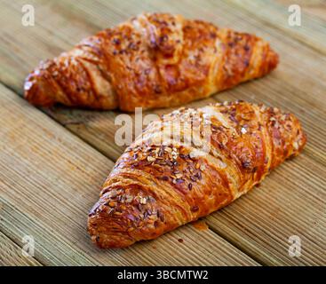 Image of fresh multigrain croissants, spanish dessert on wooden table ...