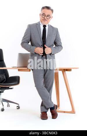 older business professional standing upright at a desk Stock Photo - Alamy