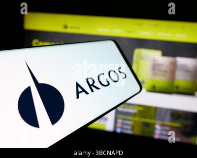 In this photo illustration, the Argos logo is displayed on a smartphone ...