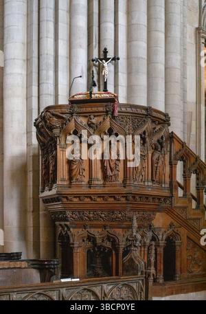 Historic wooden pulpit with ornate carvings inside church interior ...