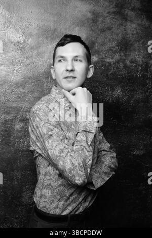 A distinguished gentleman with a thoughtful expression, dressed in ...