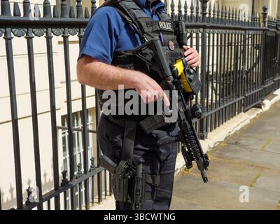 Armed police with guns guarding a foreign embassy in Belgravia, London ...