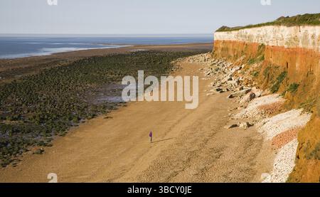 Red and white striped cliffs (carstone and chalk ) at hunstanton ...