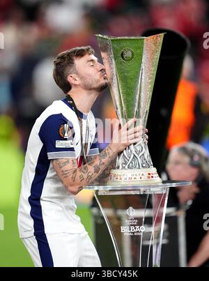 James Maddison of Tottenham celebrates with the trophy after winning ...