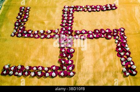 Flower Rangoli - Swastik Made out of Flowers Stock Photo - Alamy