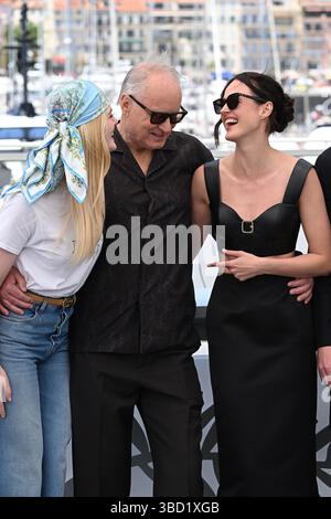 Elle Fanning, left and Stellan Skarsgard pose for photographers upon ...