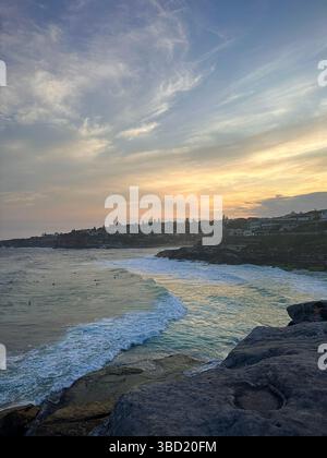 Waves rolling in towards the rocks Stock Photo - Alamy