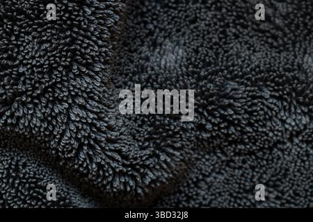 Black terry cloth background with loop texture, soft textile template ...