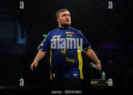 Luke Littler leaves the stage after victory against Gian van Veen in ...