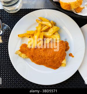 Steamed cod fillet with paprika sauce and salad leaves Stock Photo - Alamy
