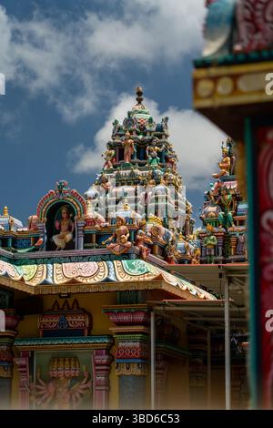 Cap Malheureux, Mauritius - May 12, 2024: Temple rooftop statues and ...