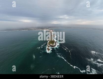 Wide angle view of Baleal town and cliffs with cloudy sky and vast ...