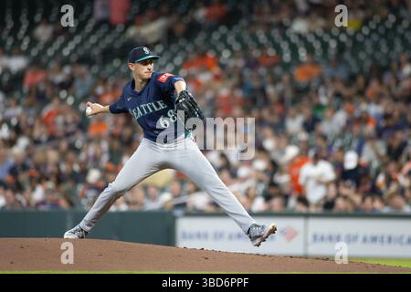 Seattle Mariners pitcher George Kirby walks on the warning track during ...