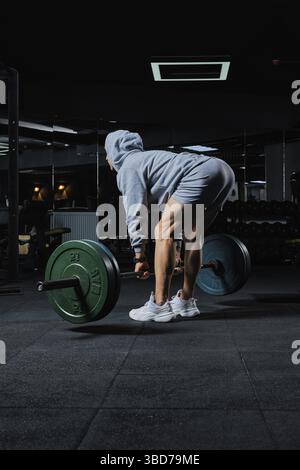 Muscular Fitness Bodybuilder Doing Heavy Weight Exercise For Shoulders ...