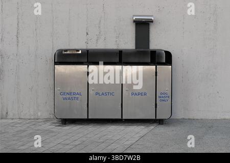 A modern waste sorting bin against the trees in the park Stock Photo ...