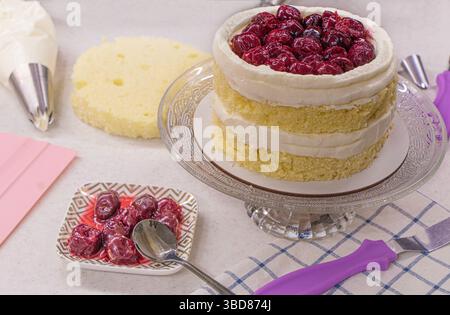 Cherry cake assembly process. dessert recipe background Stock Photo - Alamy