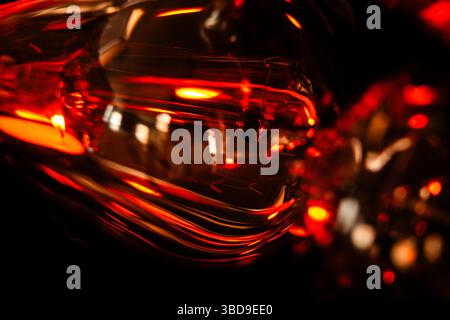Macro image of filaments inside edison bulb in warm light Stock Photo ...